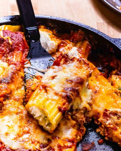 Creamy Four Cheese Baked Manicotti - Sip and Feast