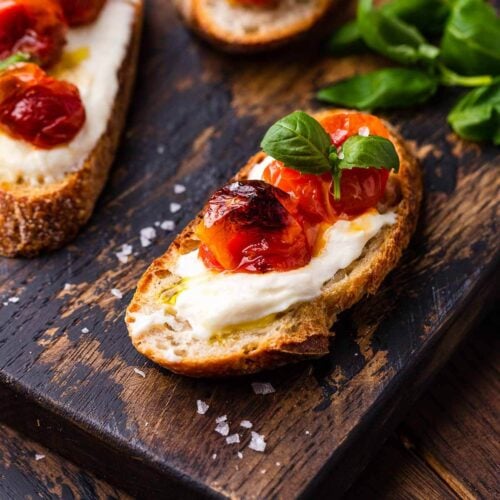 Ricotta Roasted Cherry Tomato Crostini - Sip and Feast